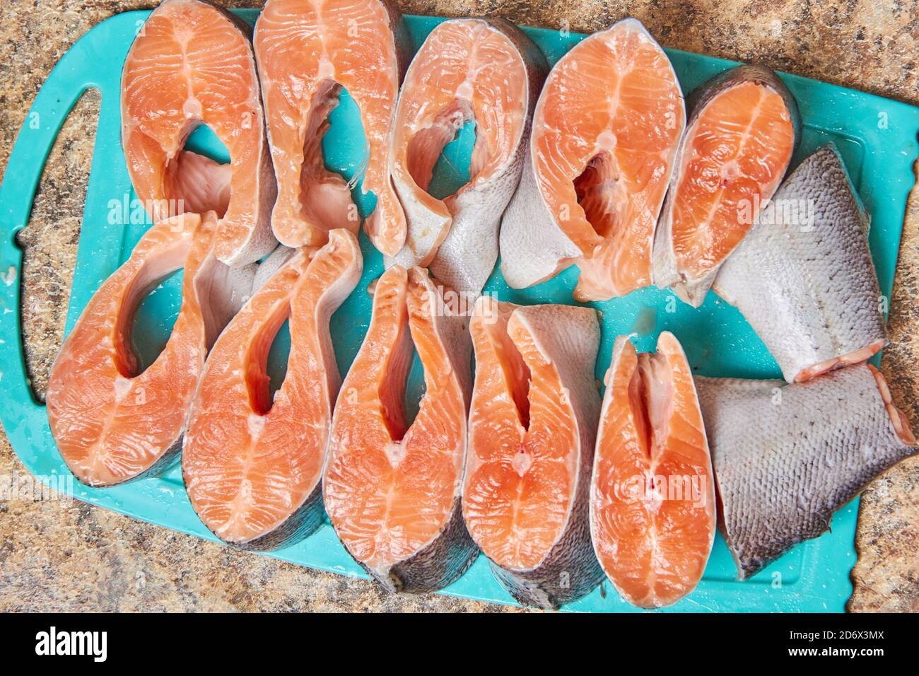 French fresh fish cut and spread on cutting board Stock Photo - Alamy