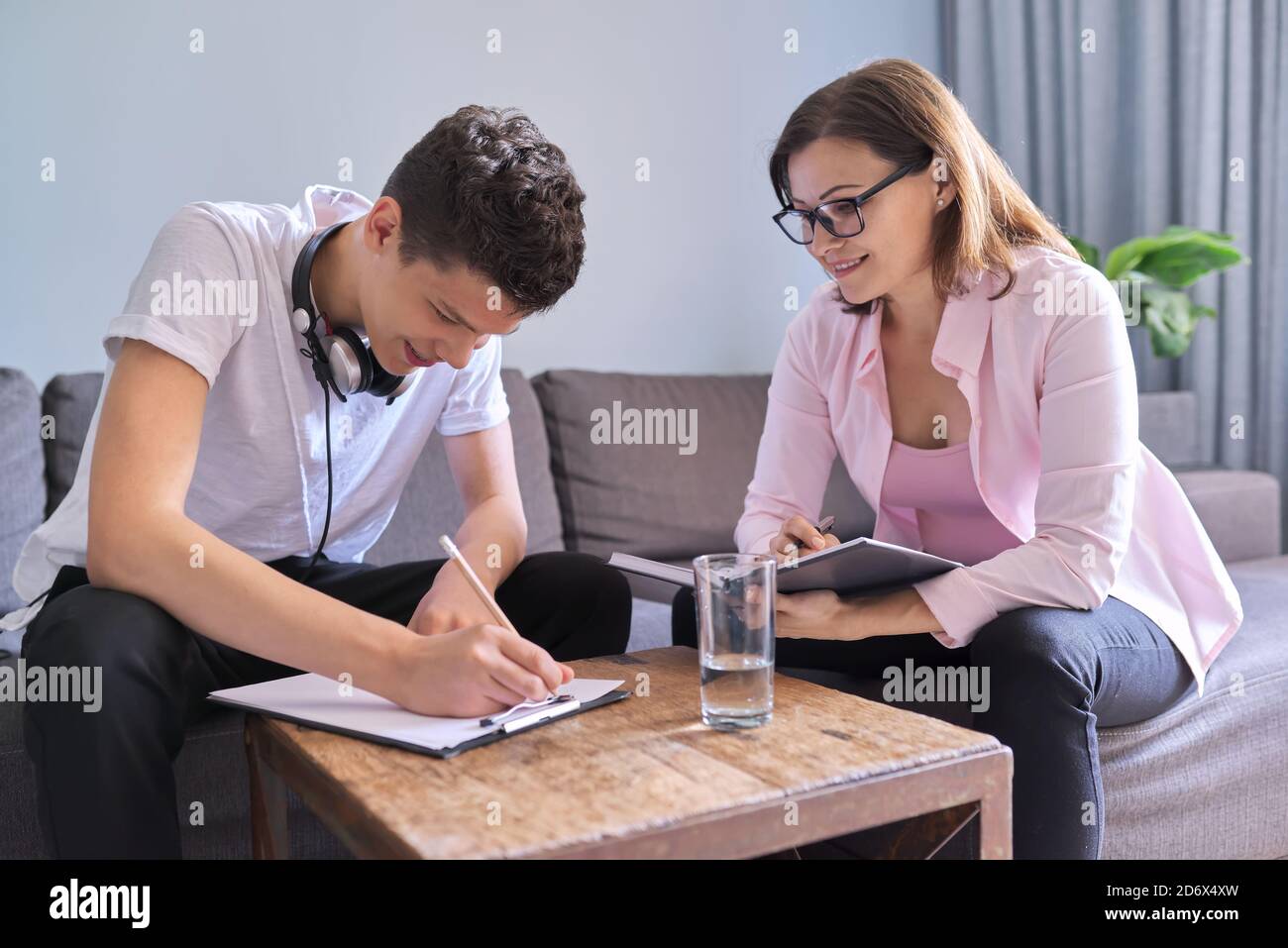 Boy teenager gives interview to woman psychologist in office Stock ...