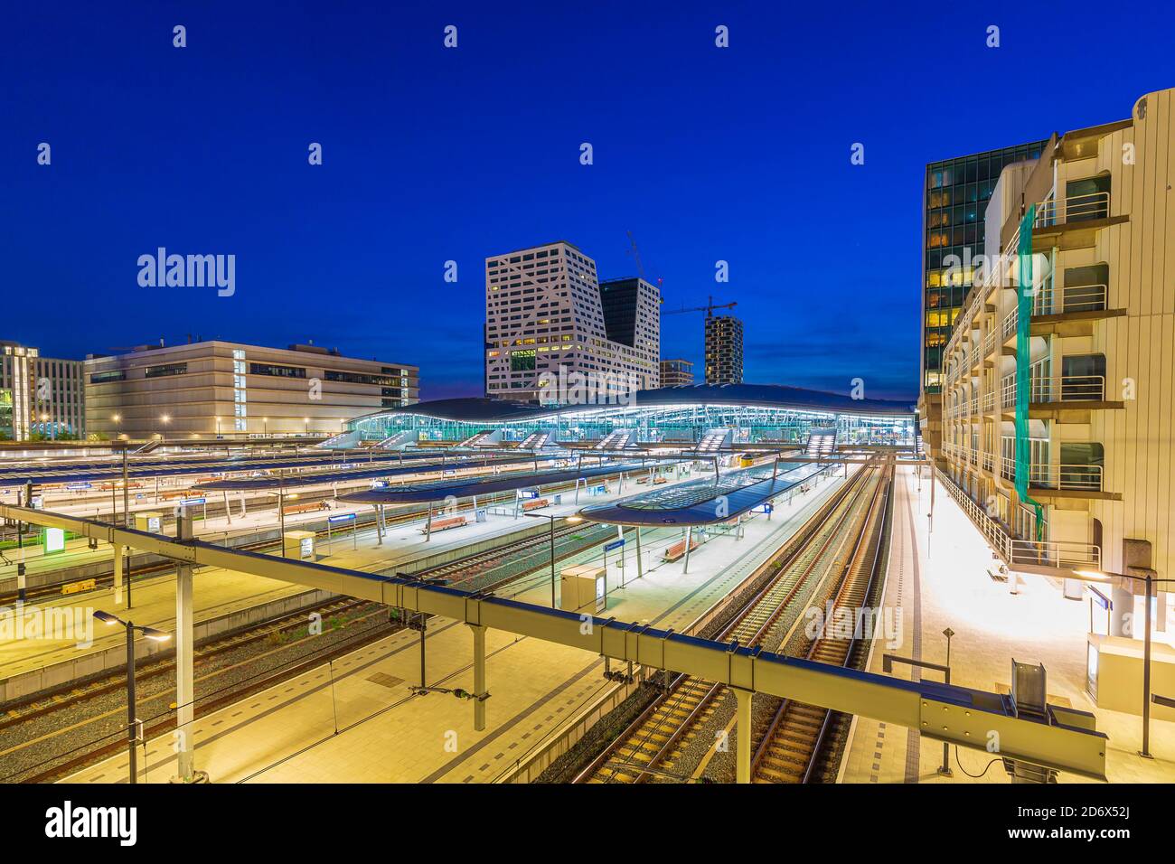 Utrecht central railway station at dusk. Modern contemporary ...