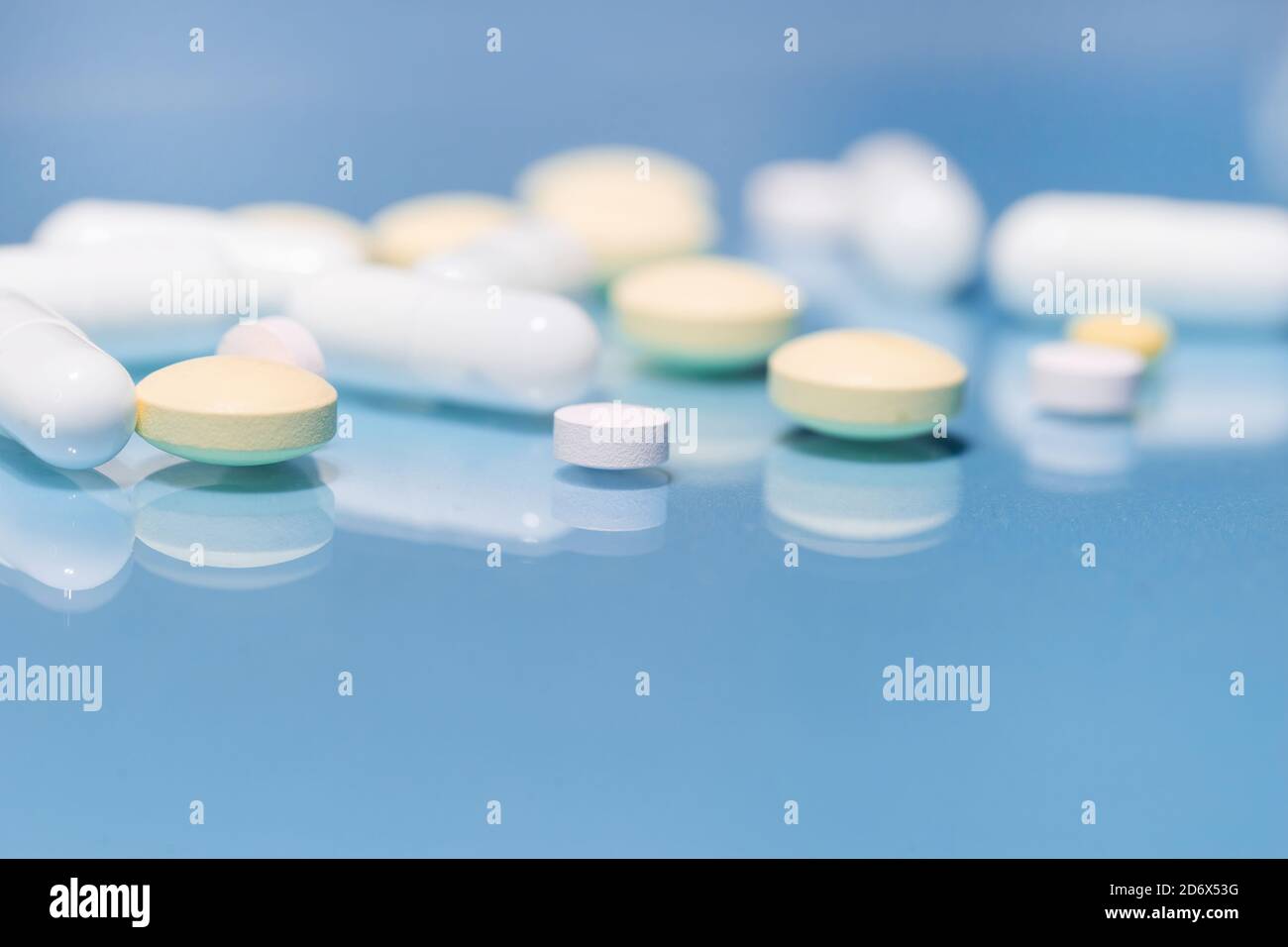 background image of a tablet and pill on the table Stock Photo - Alamy