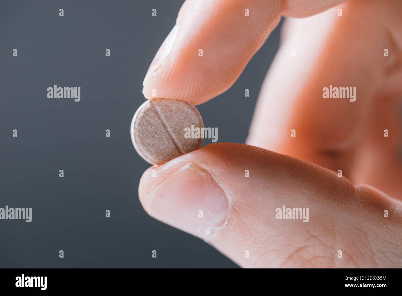 close up. white round tablet in hand Stock Photo - Alamy