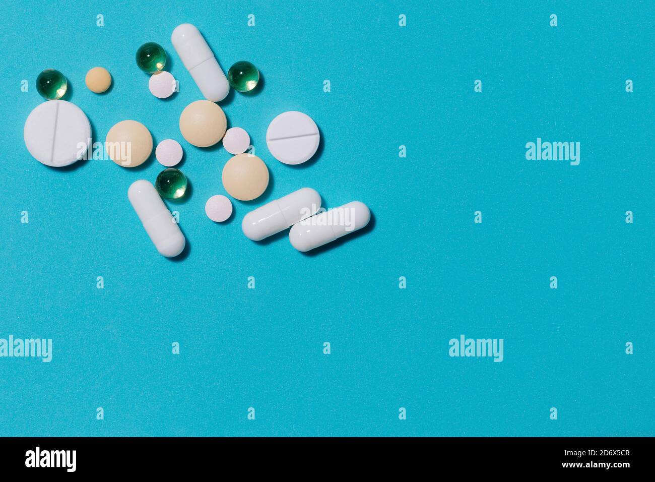 tablets and dietary supplements on a blue background Stock Photo - Alamy