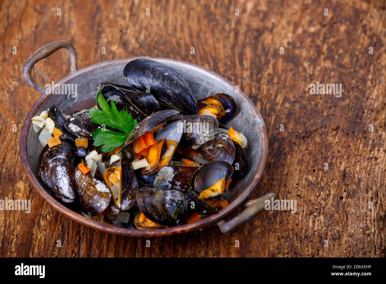 cooked mussels on dark wood Stock Photo - Alamy