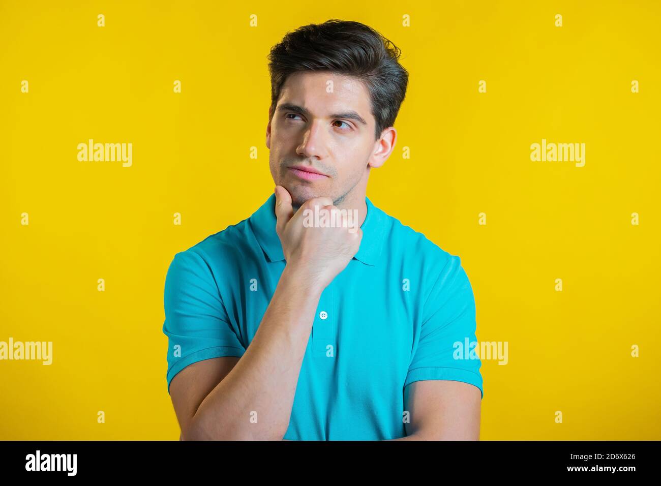 Thinking man looking up and around on yellow background. Pensive face ...