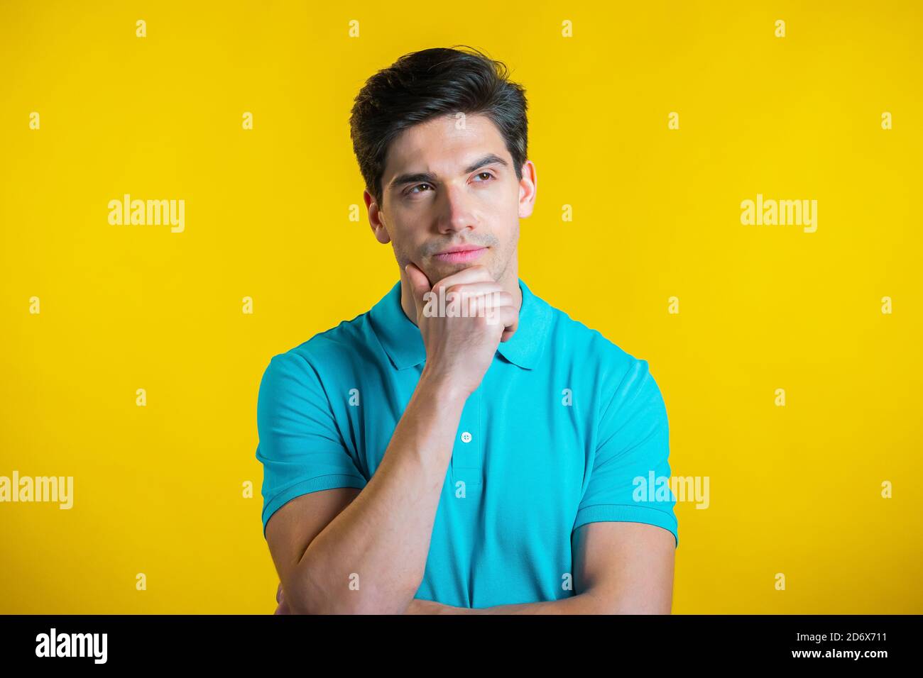 Thinking man looking up and around on yellow background. Pensive face ...