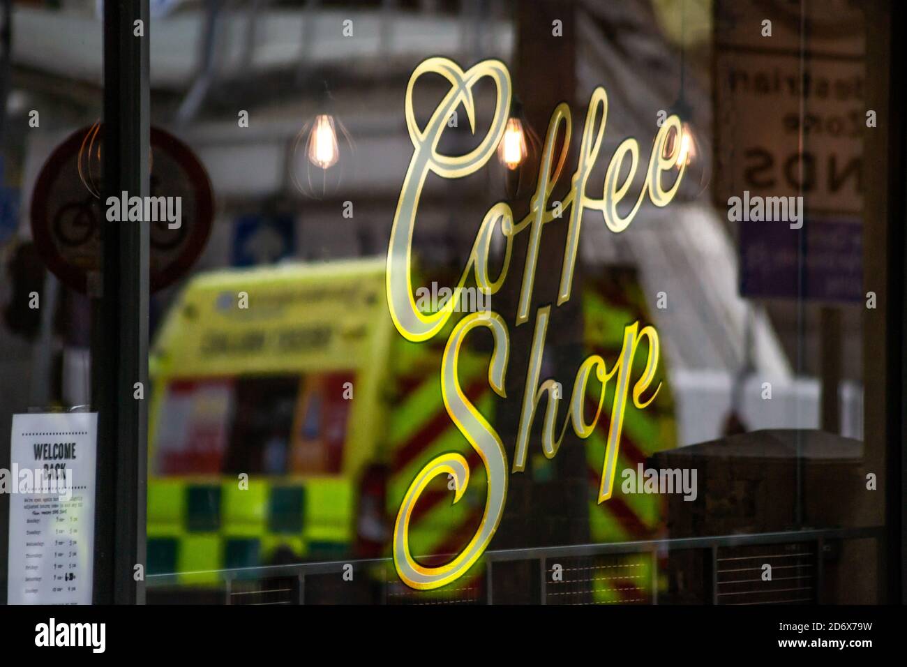 Coffee Shop, Ambulance in window reflection Stock Photo - Alamy