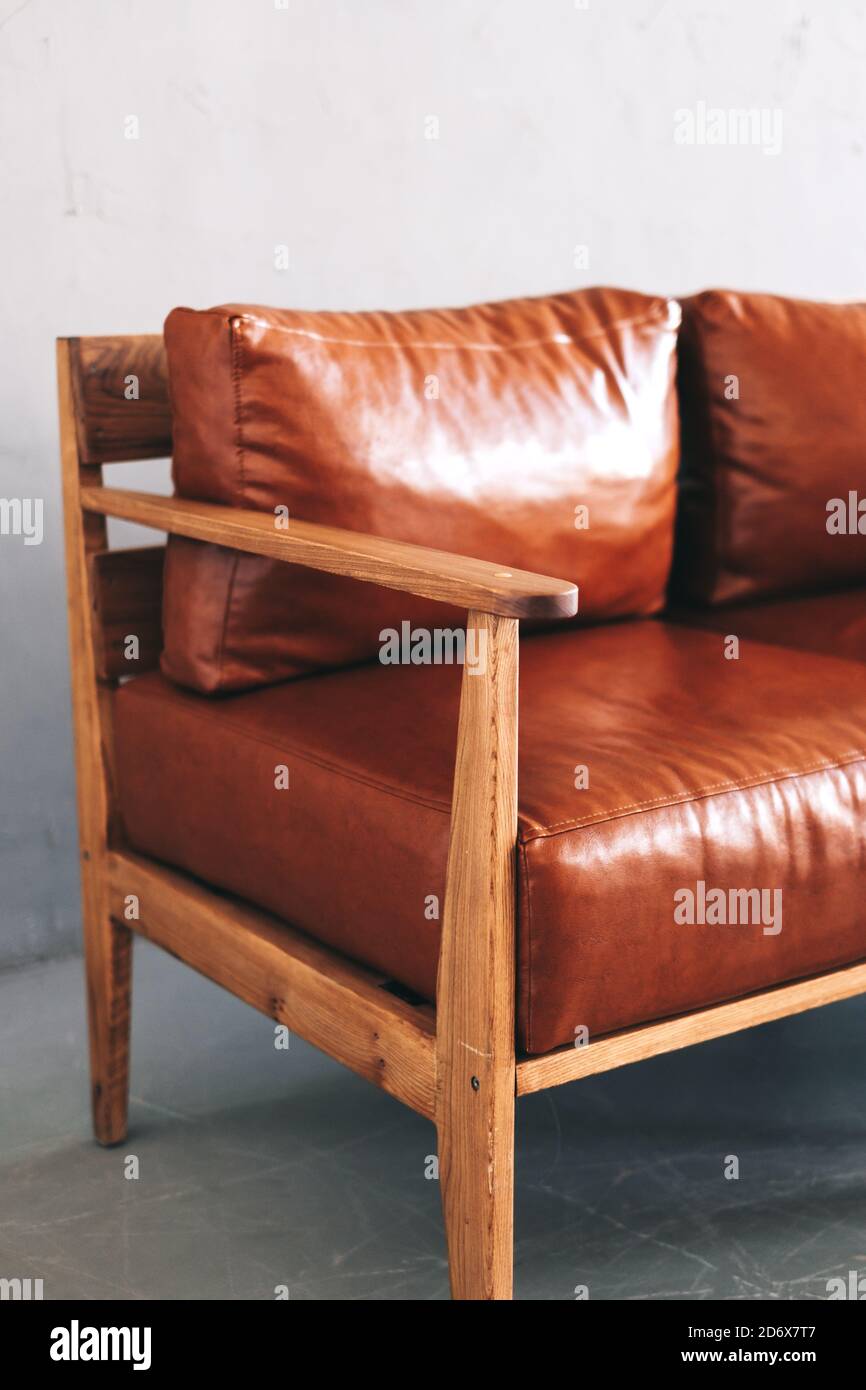 Interior detail of modern living room with brown leather sofa. Close-up ...