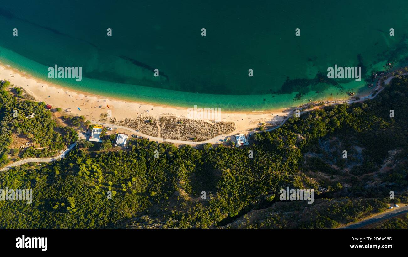 Aerial view of blue Atlantic ocean, green forest mountains and sandy ...