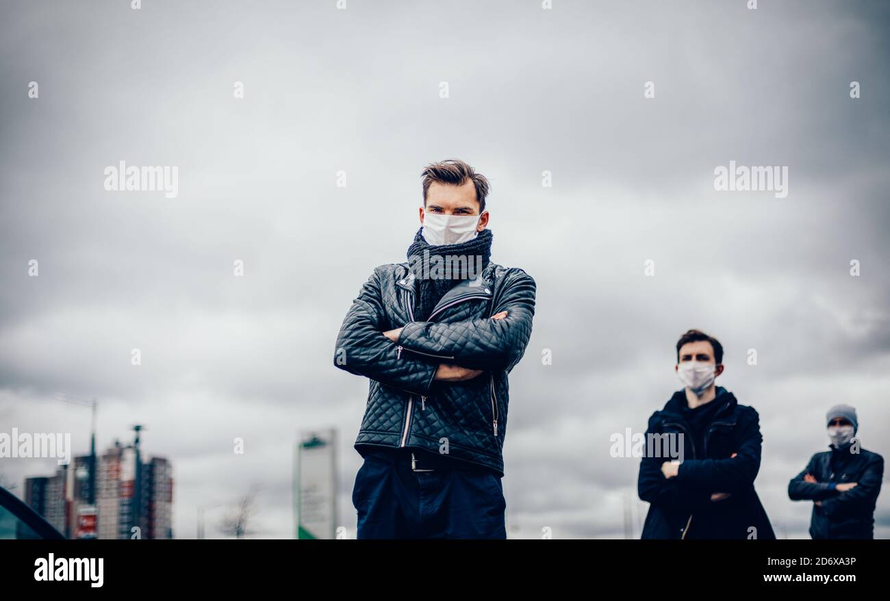 people standing at a safe distance on a city street Stock Photo - Alamy