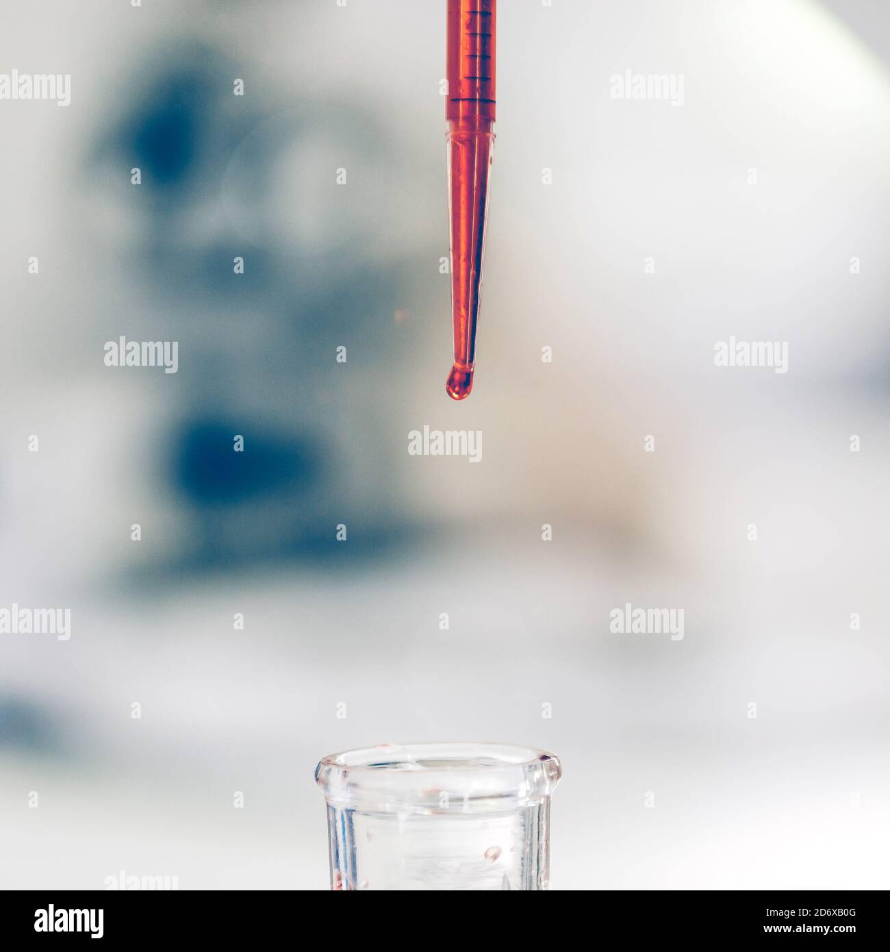 close up. background image of a drop of red liquid in a laboratory ...
