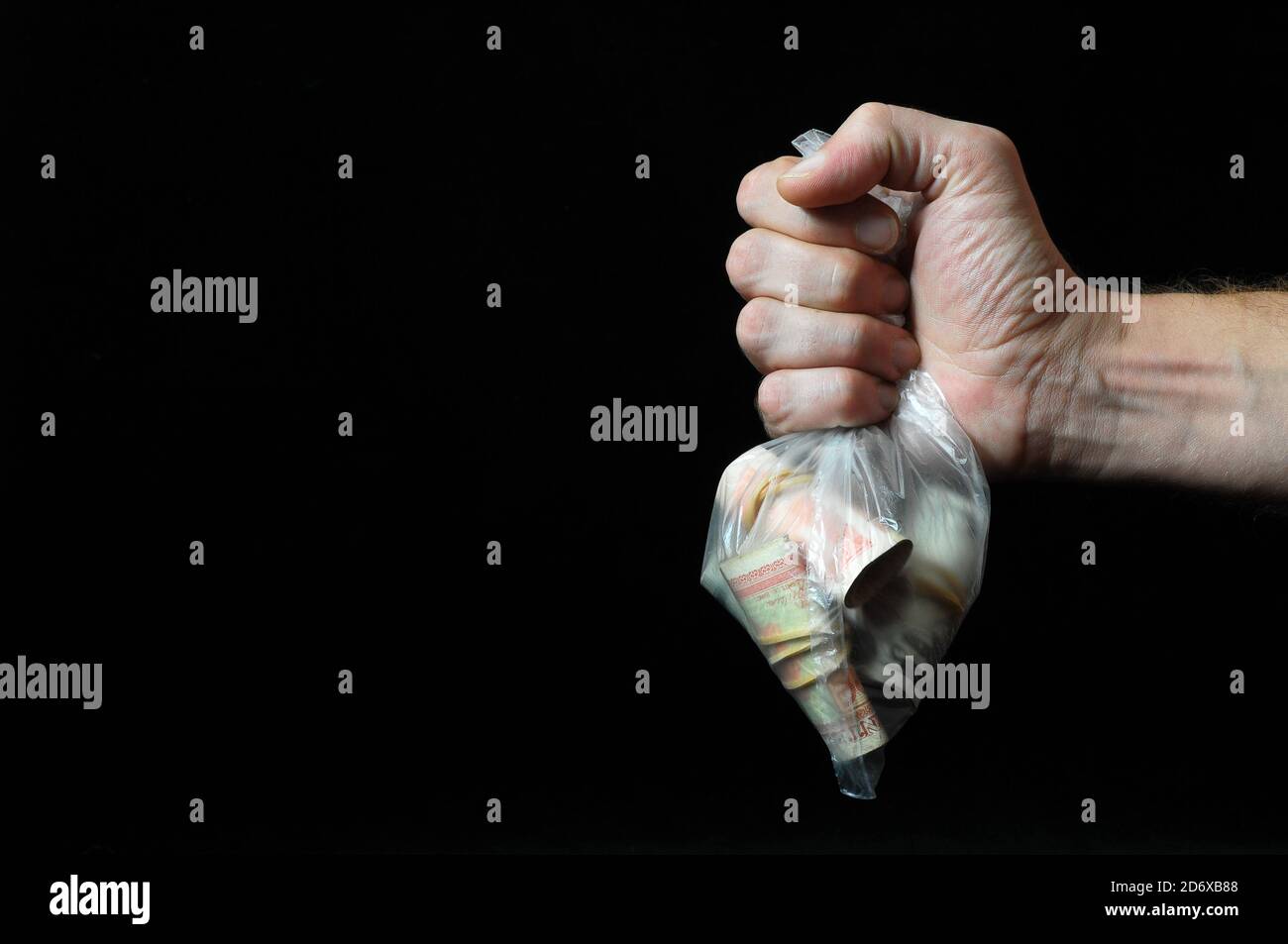 Trapped Money And an Hand Stock Photo - Alamy