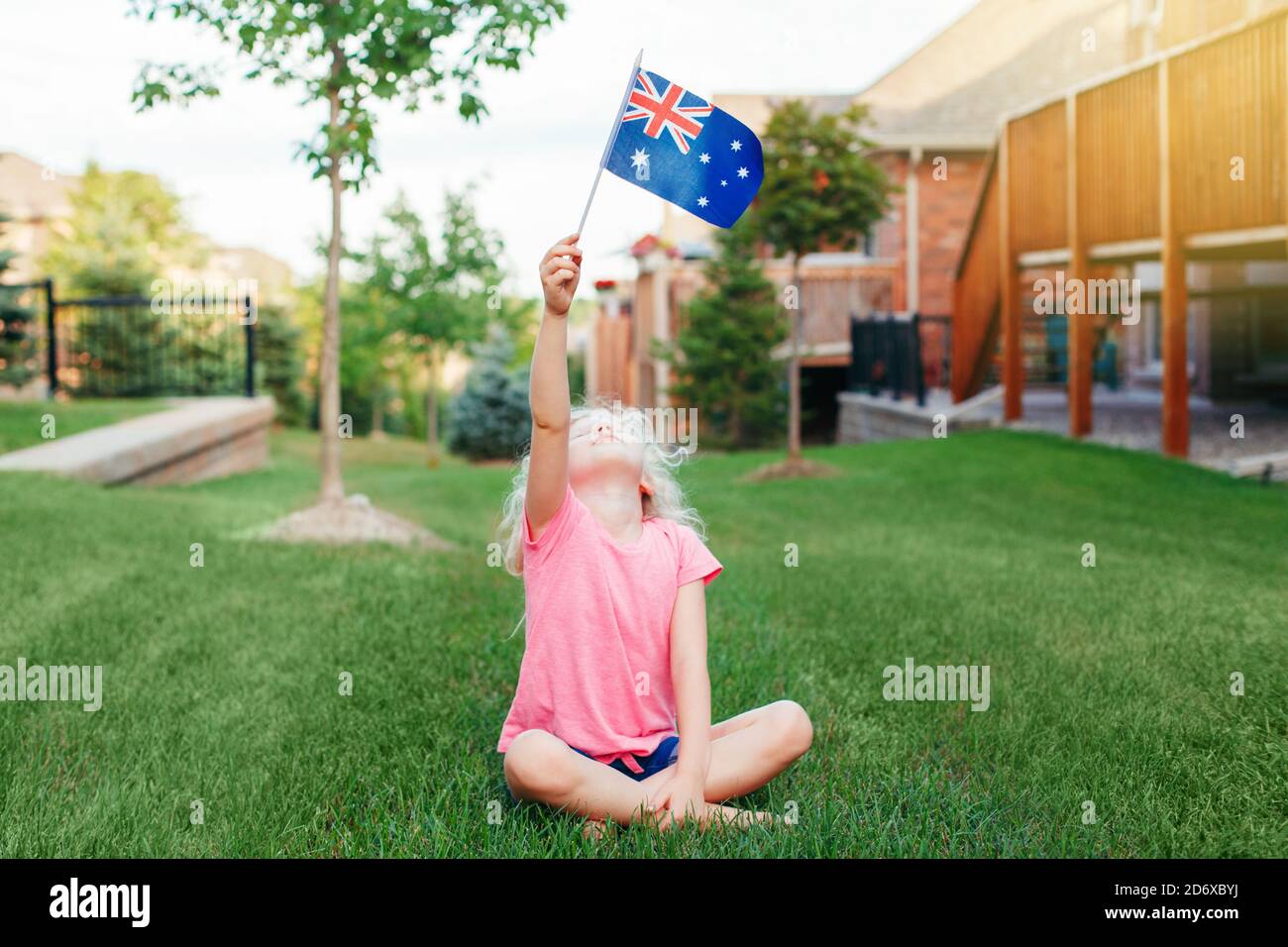 Adorable cute happy Caucasian girl holding Australian flag. Smiling ...