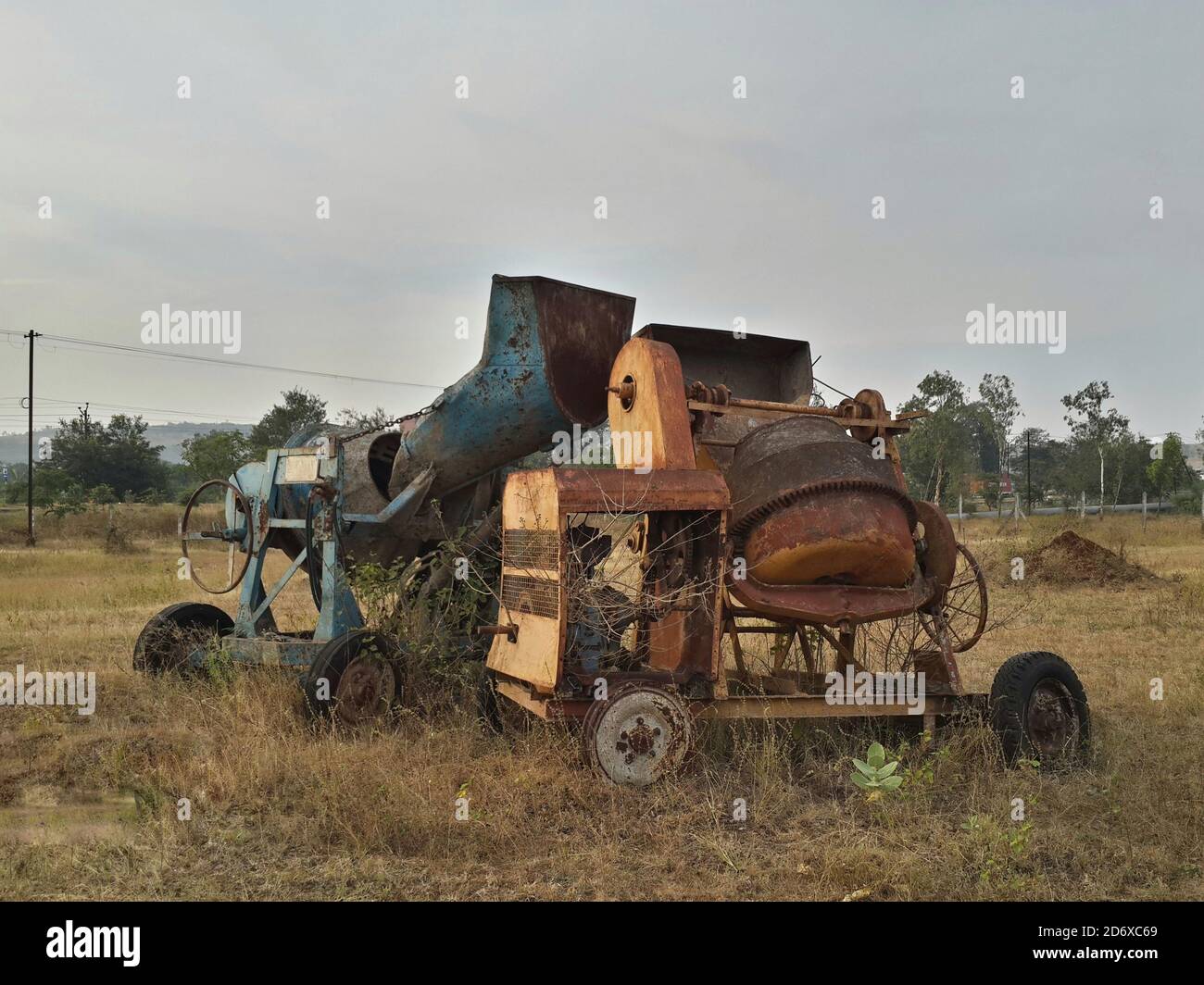 Pile of old rusty scrap metal from agricultural machinery in a dry ...