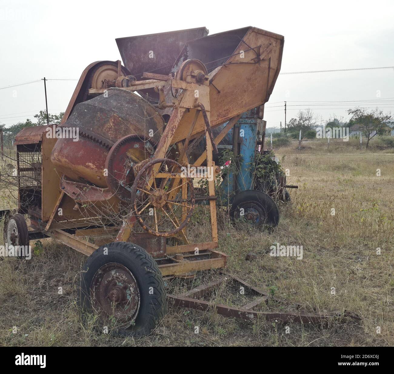 Pile of old rusty scrap metal from agricultural machinery in a dry ...