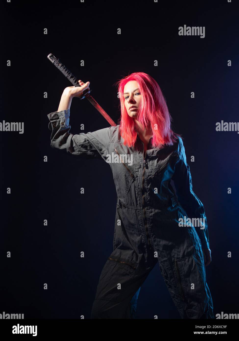 Cyberpunk and futurism, concept. A young woman with pink hair and ...