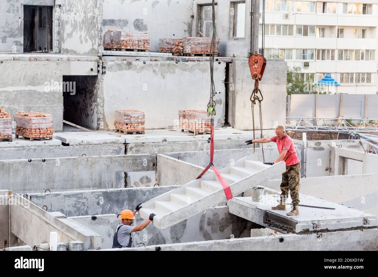 Russia, Vladivostok, 07/21/2020. Workers on the construction of high ...