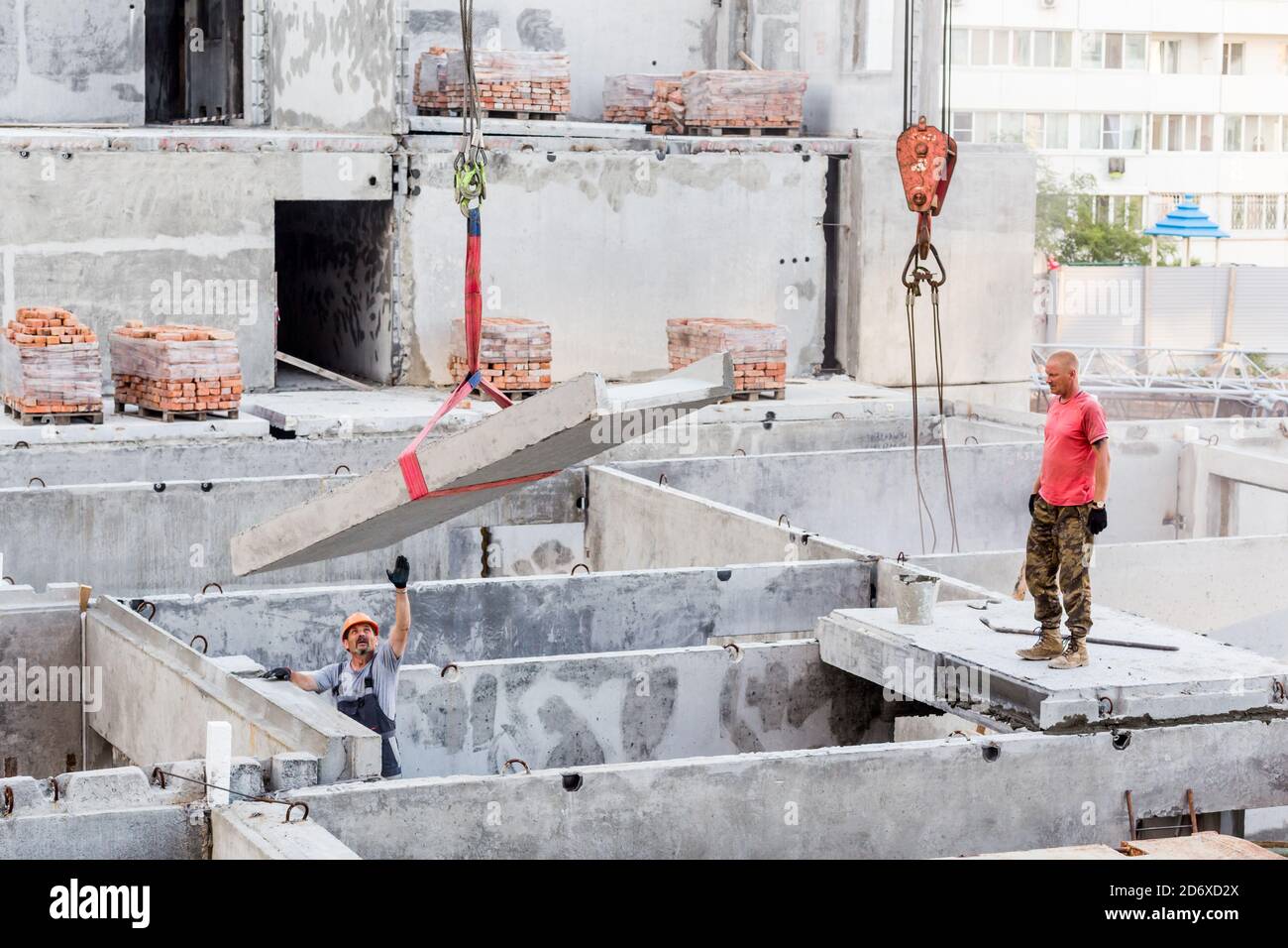 Russia, Vladivostok, 07/21/2020. Workers on the construction of high ...