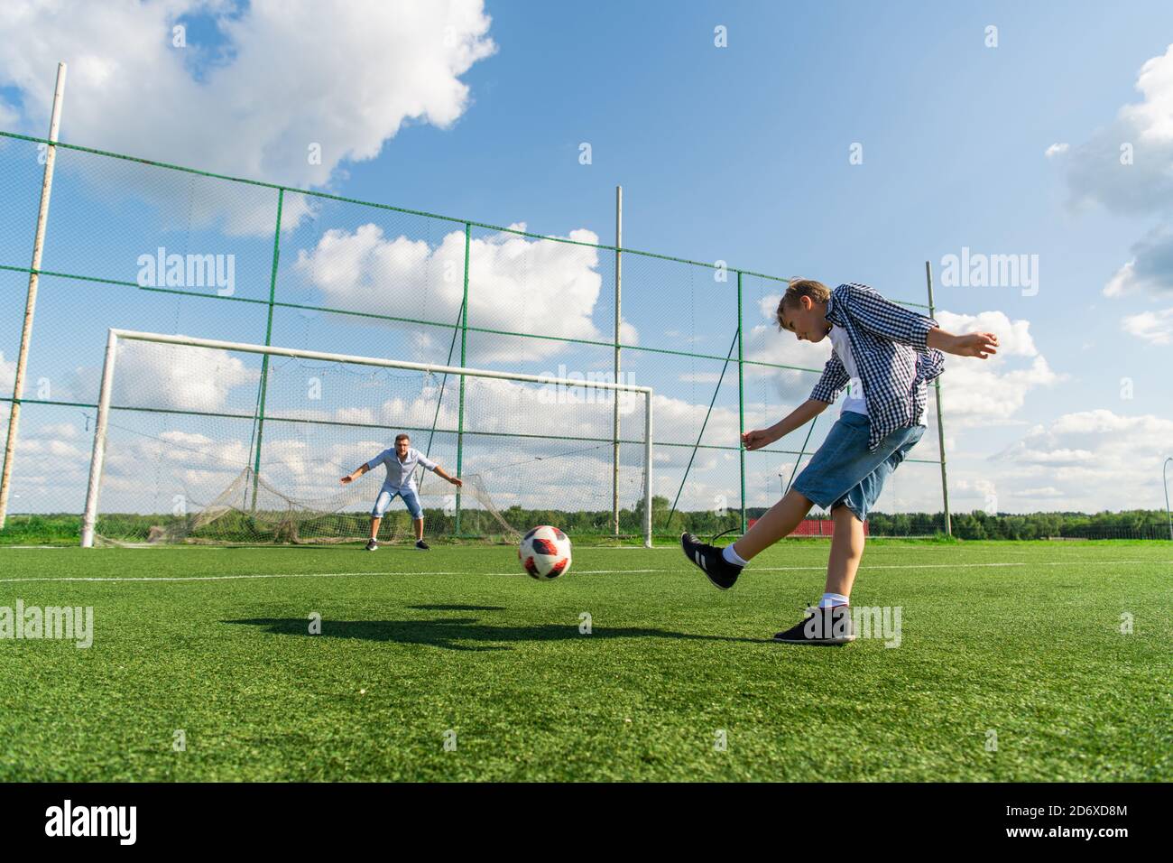 Boy playing soccer in hi-res stock photography and images - Alamy