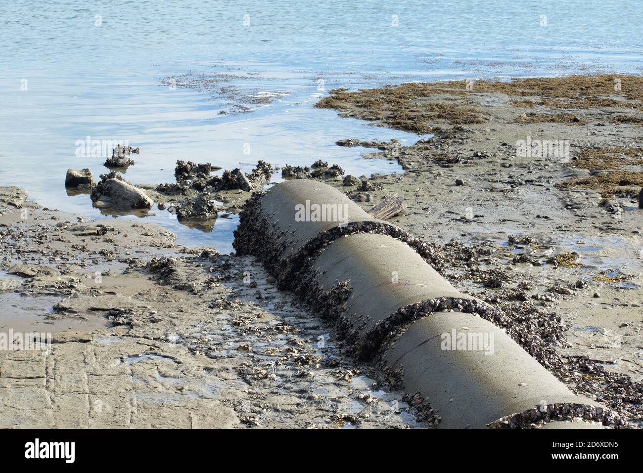 Closeup shot of concrete stormwater pipe discharge into the ocean Stock ...