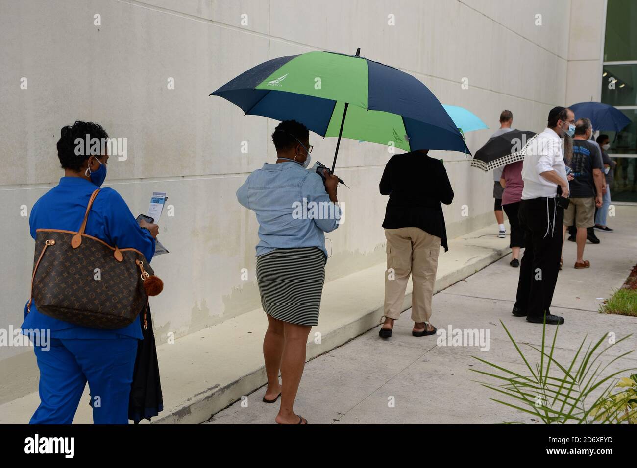 Coral Springs, FL, USA. 19th Oct, 2020. Voters are seen waiting in line ...