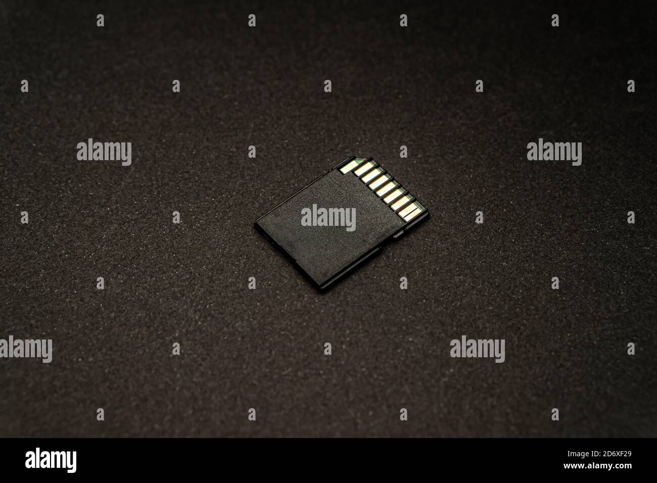 Black SD card isolated on a black background Stock Photo - Alamy