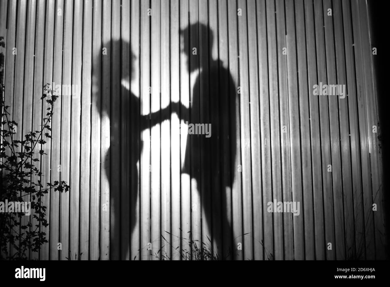 Shadows of a couple holding hands on a textured wall Stock Photo - Alamy