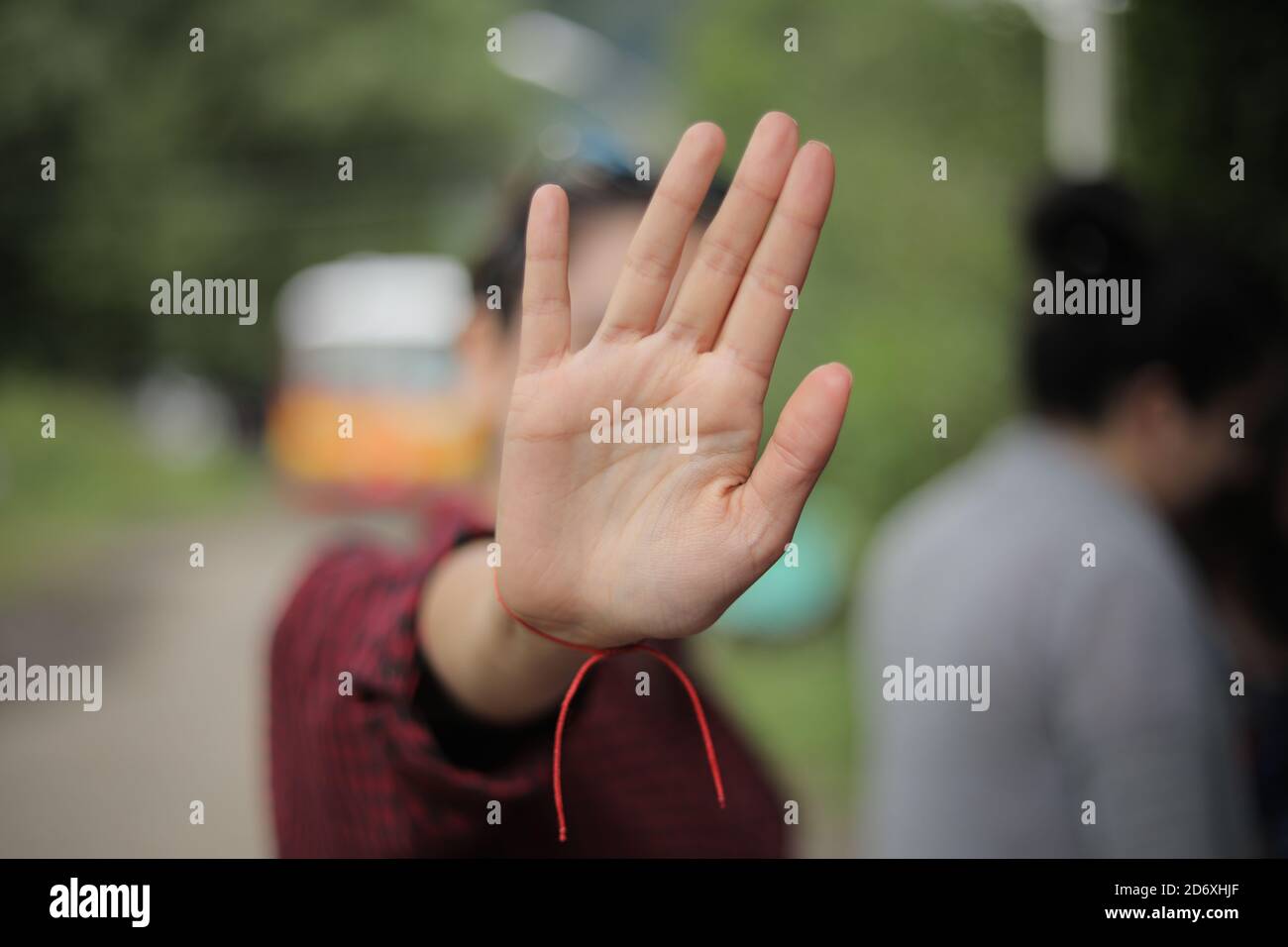 Person holding their hand in front of their face gesturing stop Stock ...