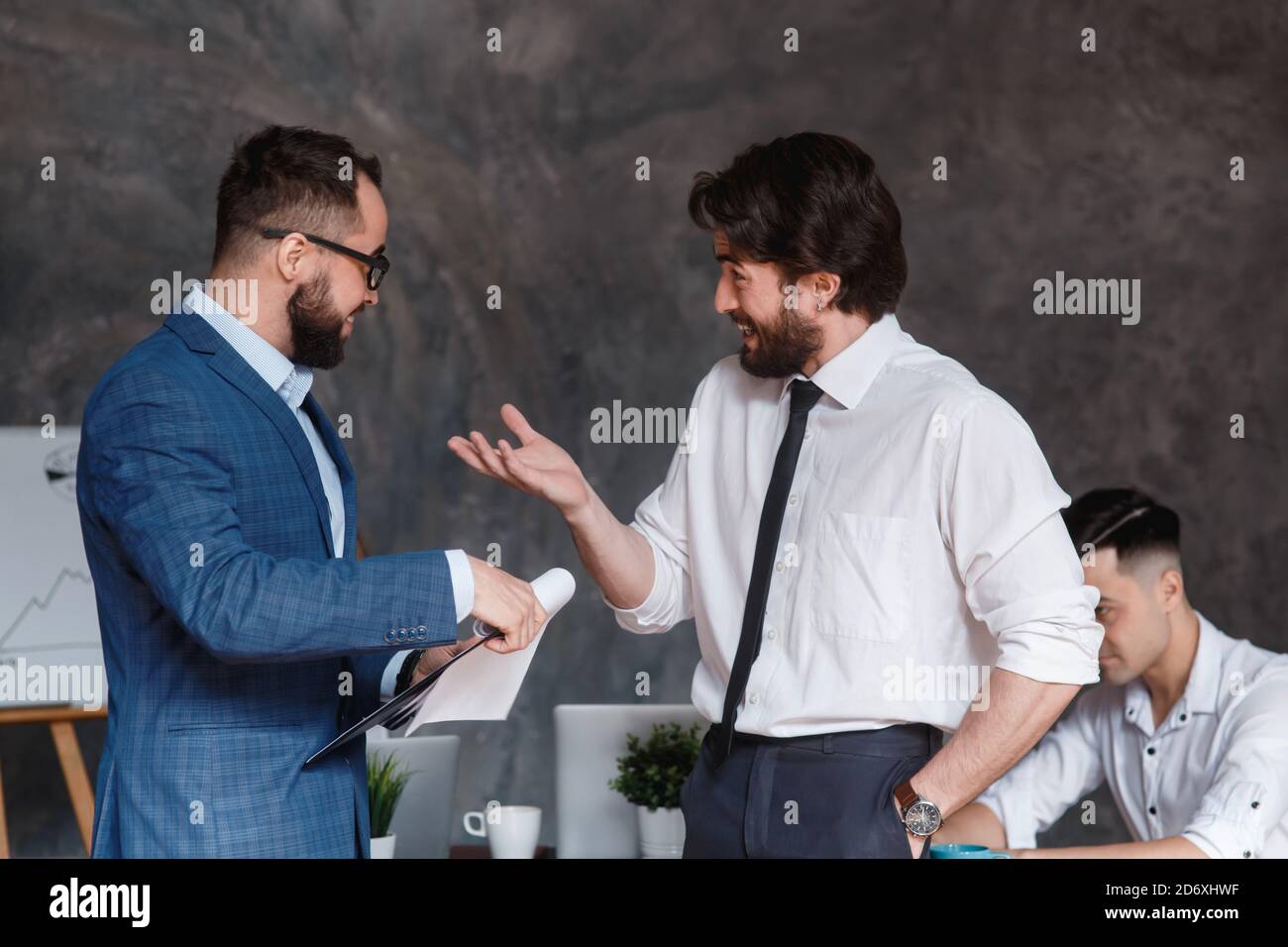 Diverse friendly male partners colleagues talking walking in modern ...