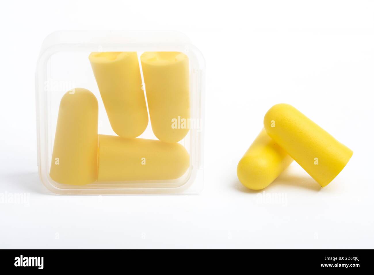 Yellow Ear plugs isolated on a white background Stock Photo - Alamy