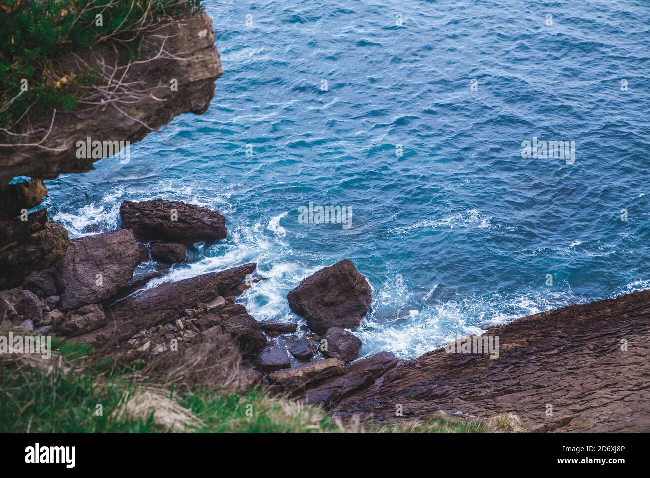 Beautiful ocean waves hitting the rocky cliffs - great for wallpapers ...