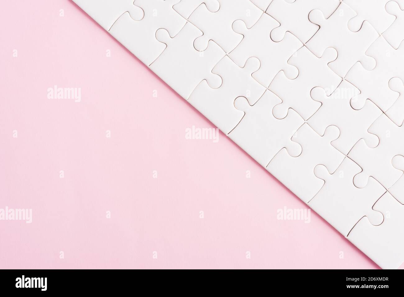 Top view flat lay of paper plain white jigsaw puzzle game texture on a ...