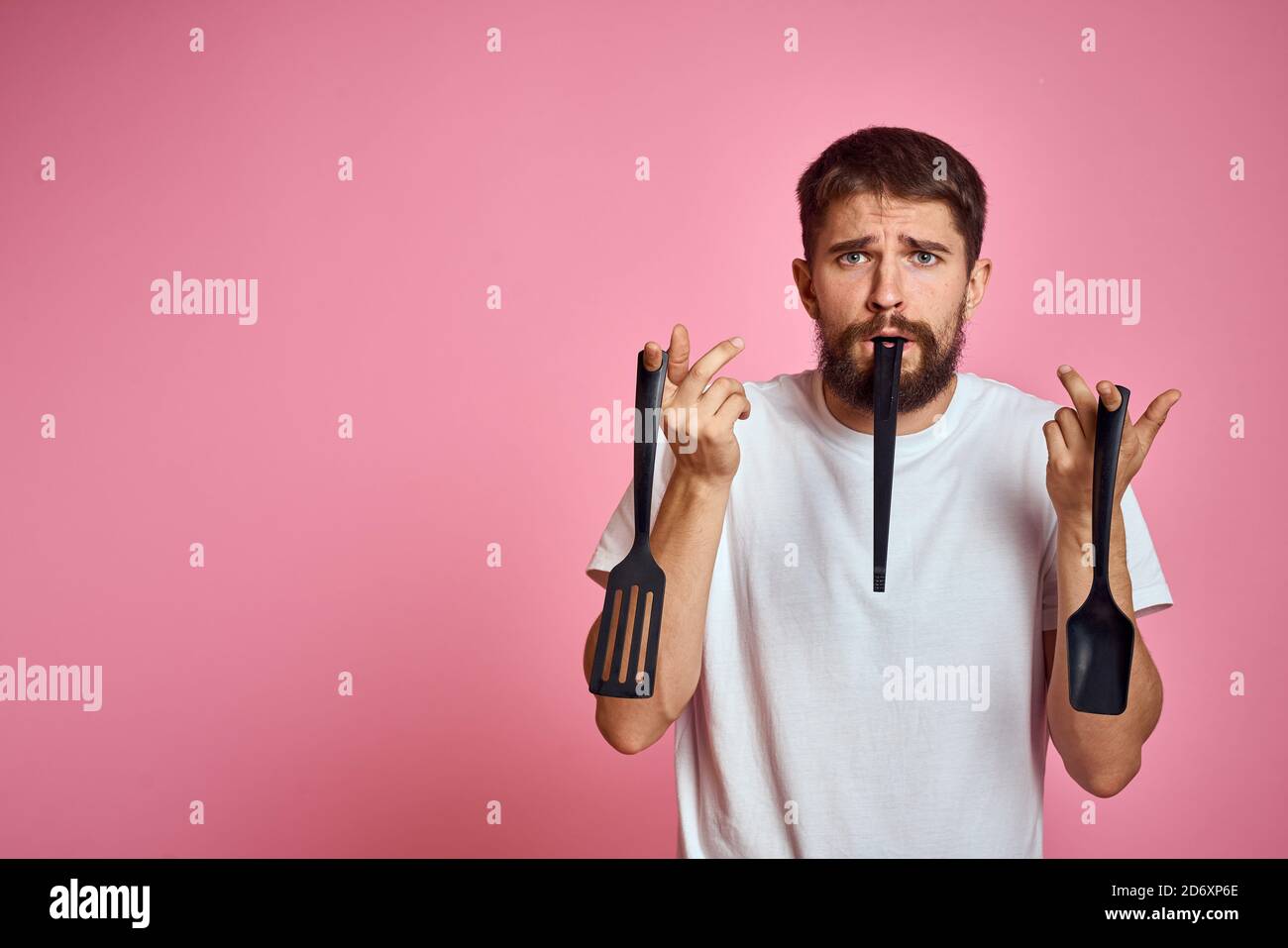 sad man with kitchen tools in hands scoop scoop emotions Stock Photo ...