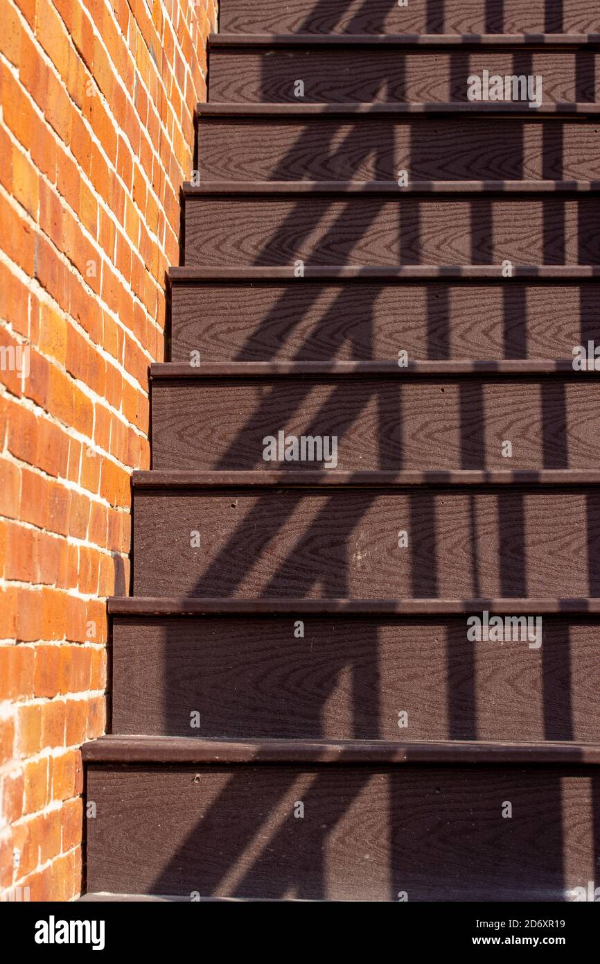 Full frame abstract texture background of a brown wooden staircase with ...