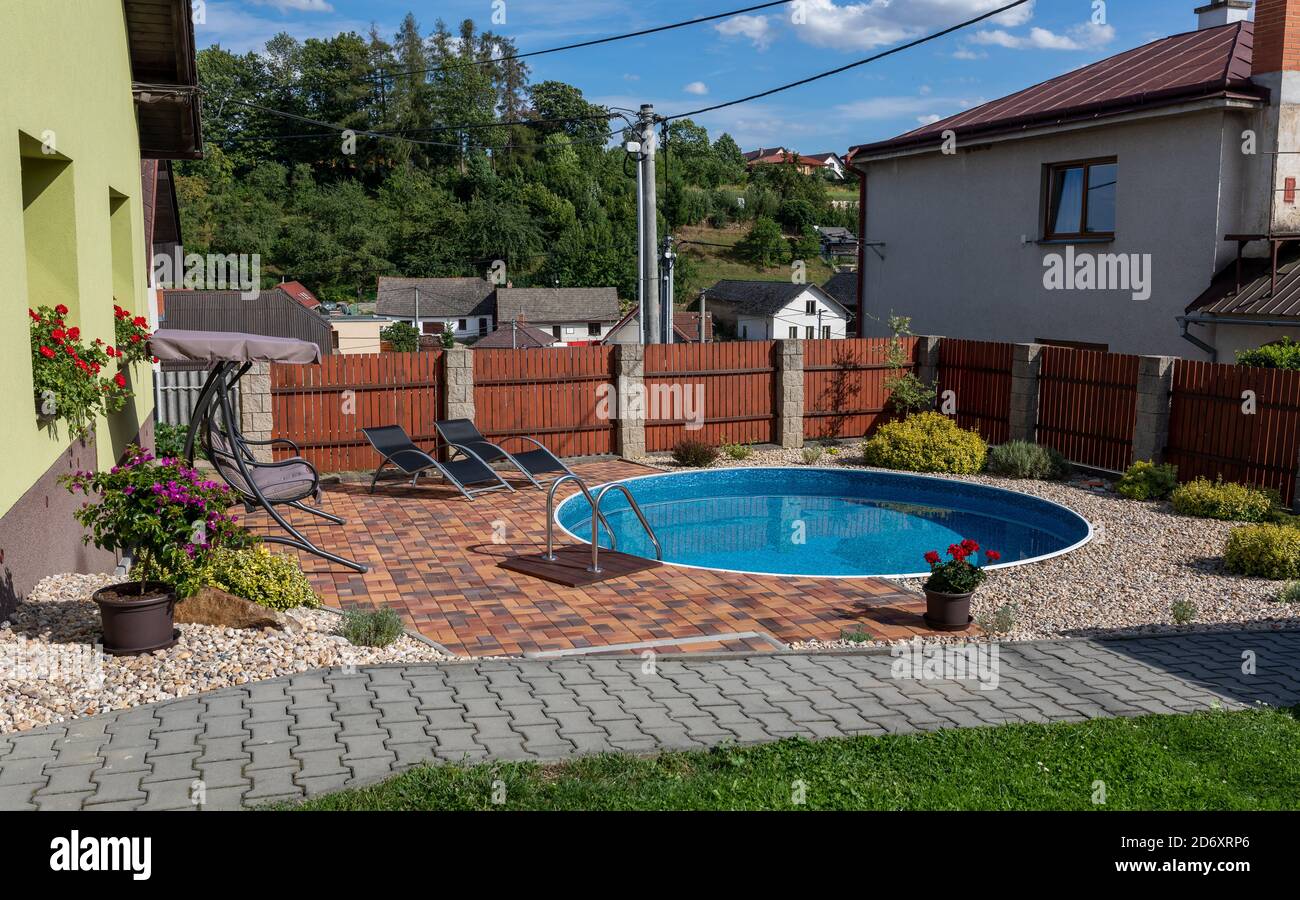 small home swimming pool with clear water in village house, Czech ...