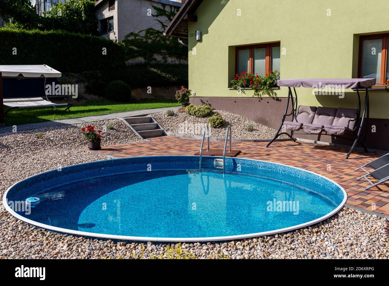 small home swimming pool with clear water in village house, Czech ...