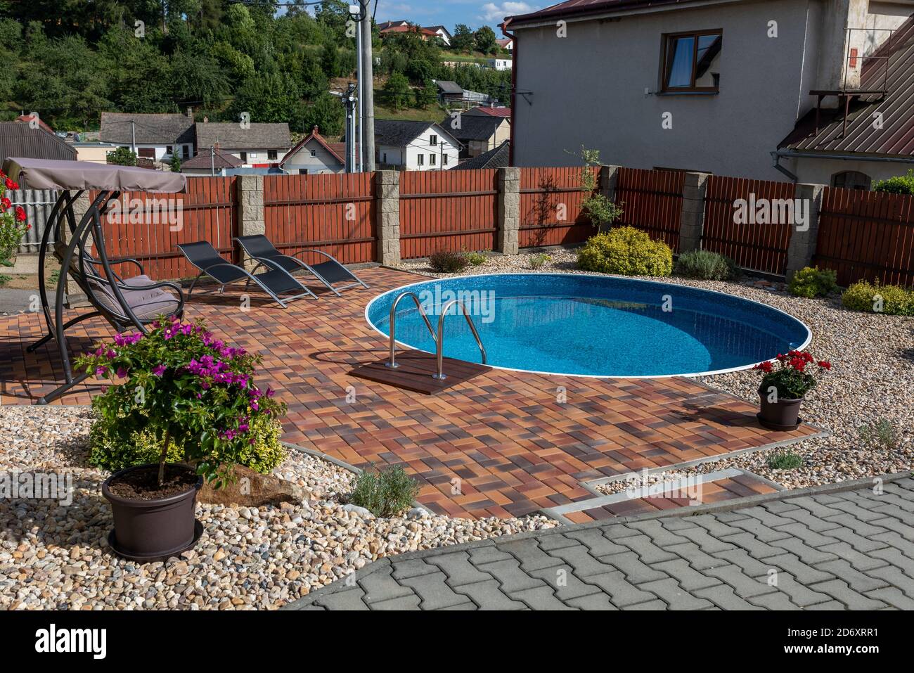small home swimming pool with clear water in village house, Czech ...