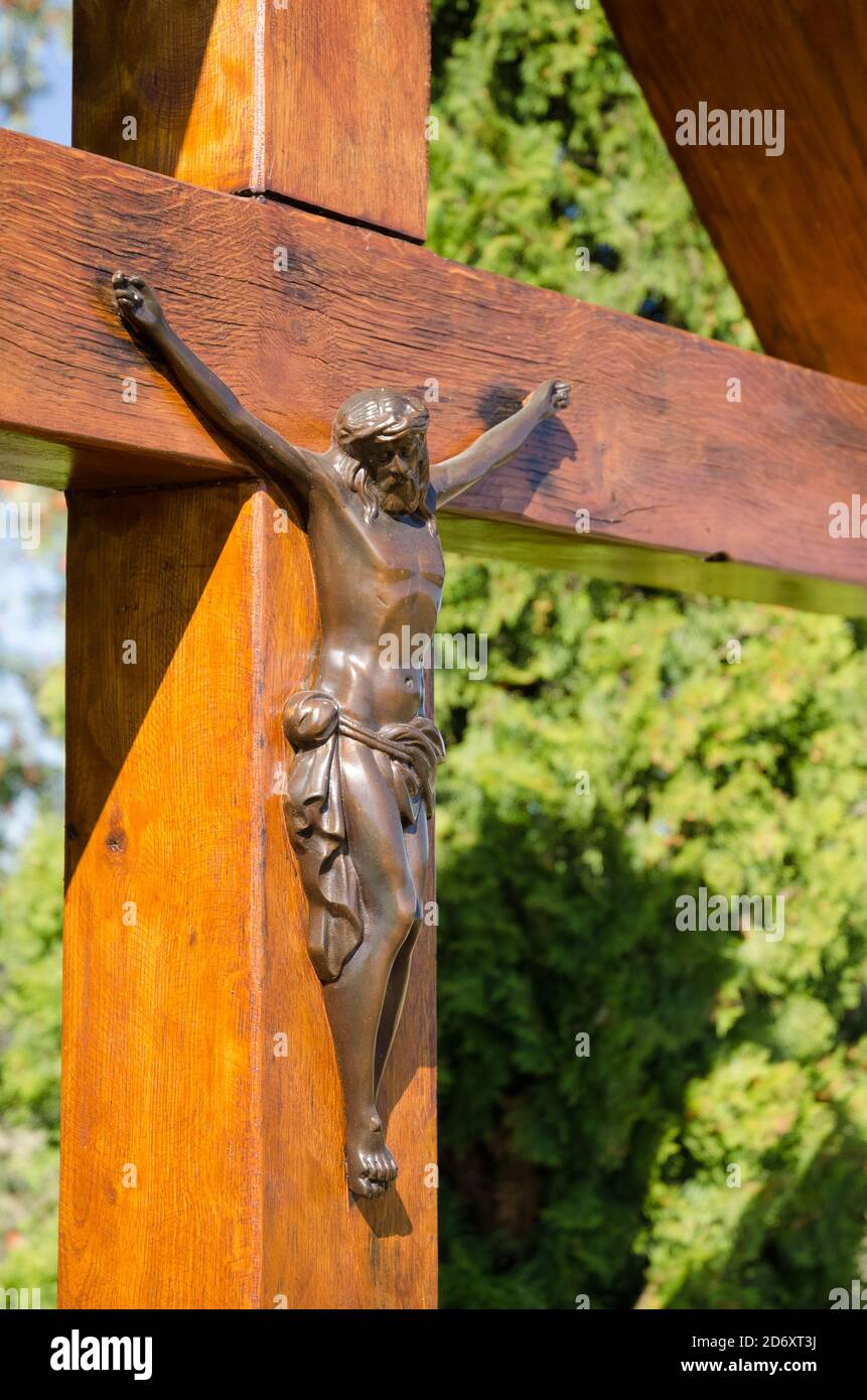 Wooden cross with Jesus Christ figure or figurine along a pilgrim route ...