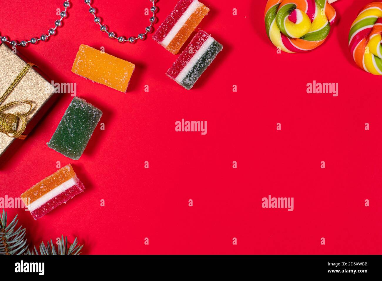 Marmalade candy and lollipops on a red New Year's background. Banner ...