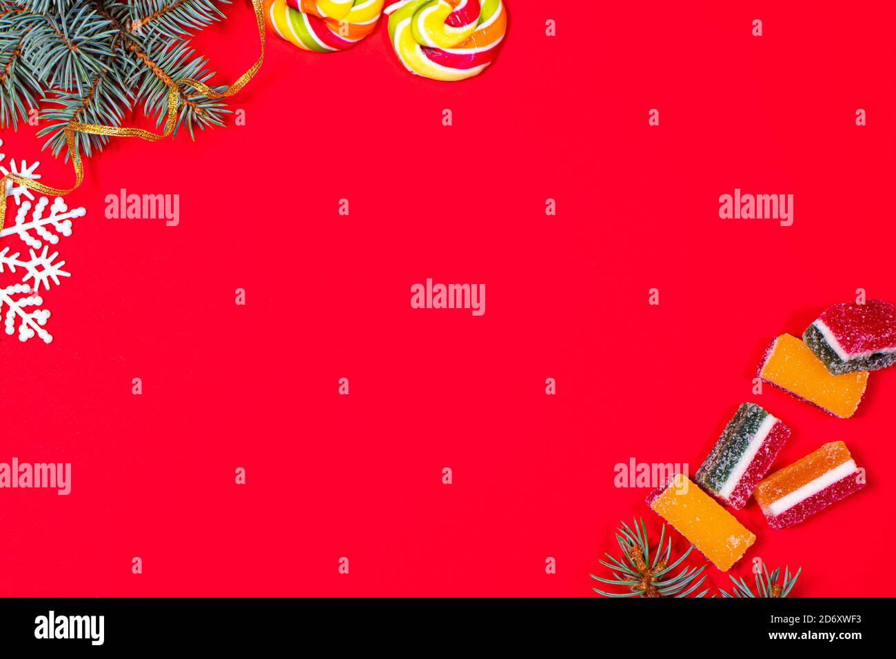 Marmalade candy and lollipops on a red New Year's background. Banner ...