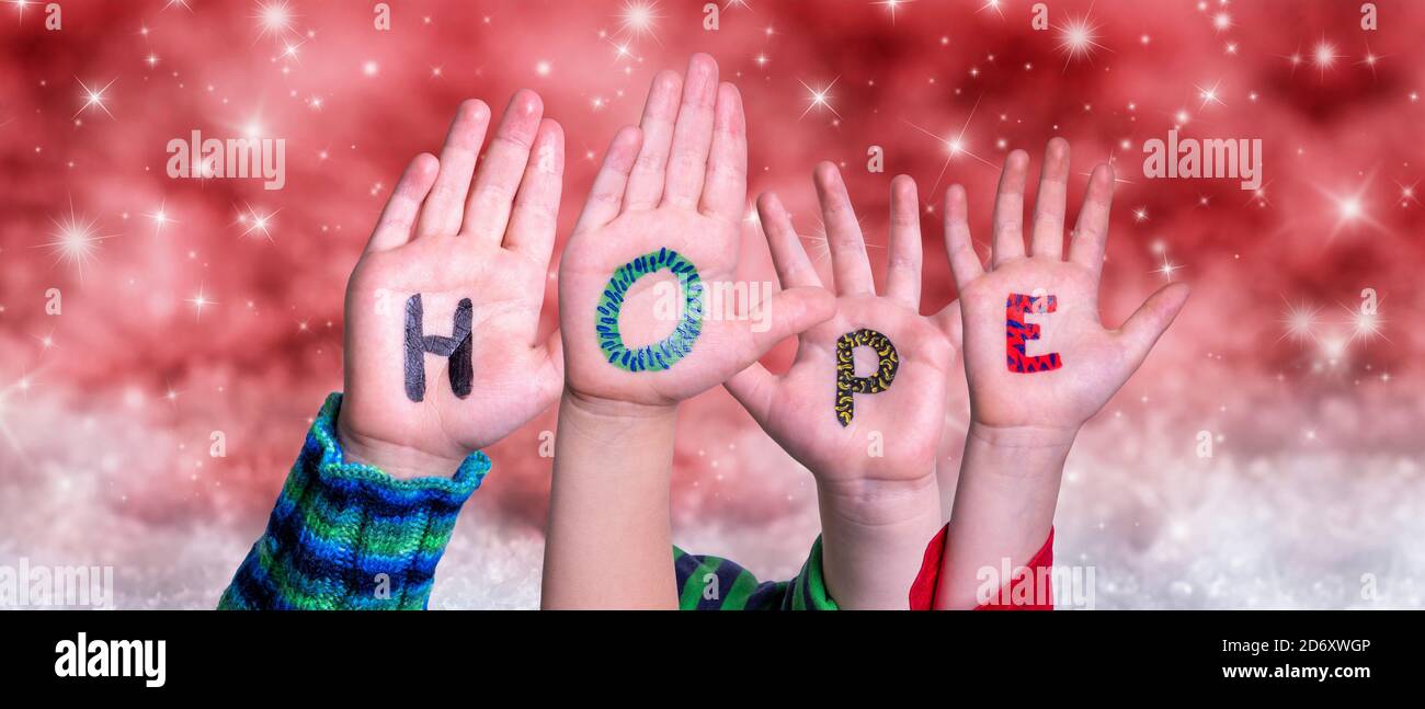 Children Hands Building Word Hope, Red Christmas Background Stock Photo ...