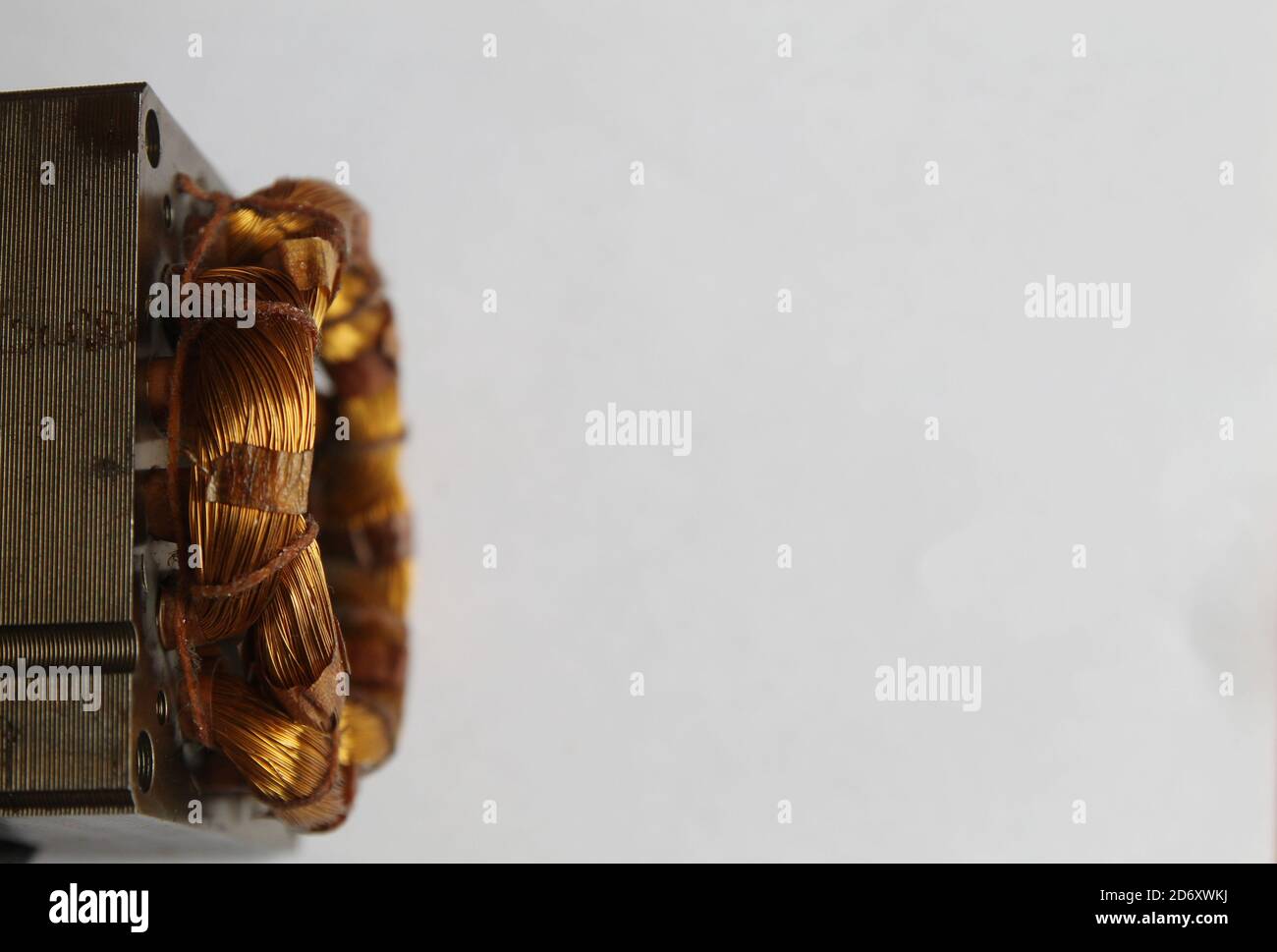 Closeup shot if an electrical machine stator with copper coil wiring ...