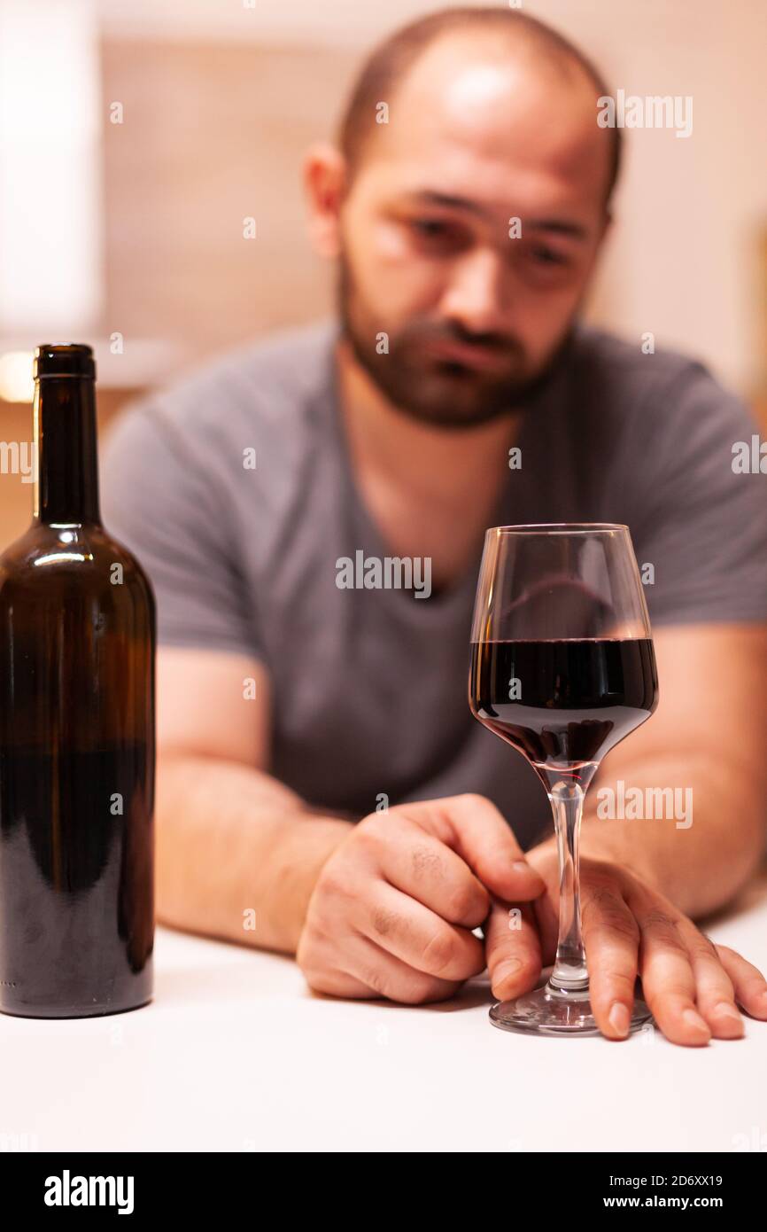 Man alcohol home unhappy hi-res stock photography and images - Alamy