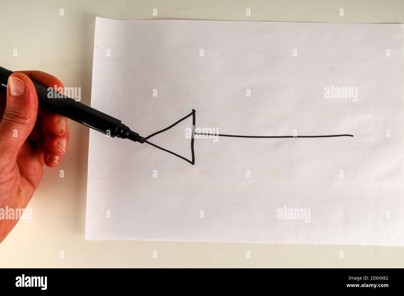 Close-up of sheet with drawing arrow Stock Photo - Alamy