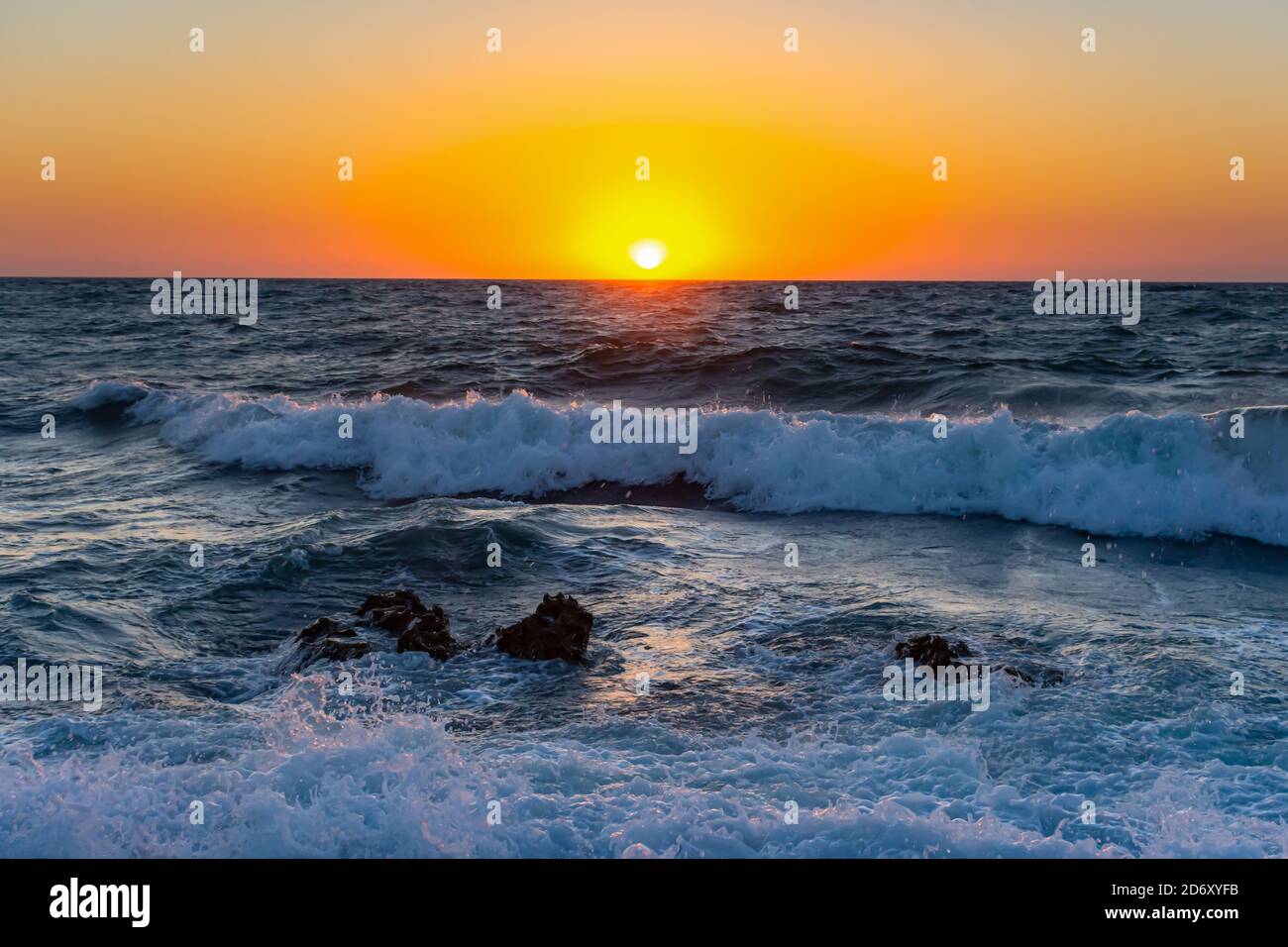 Sunset and storm at sea. Big waves against the setting sun. Summer ...