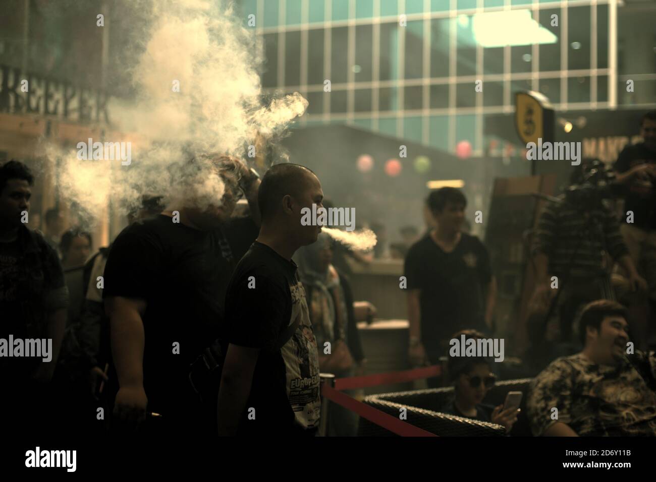 A crowd at the backstage of one of the exhibitors' stands during Vape ...