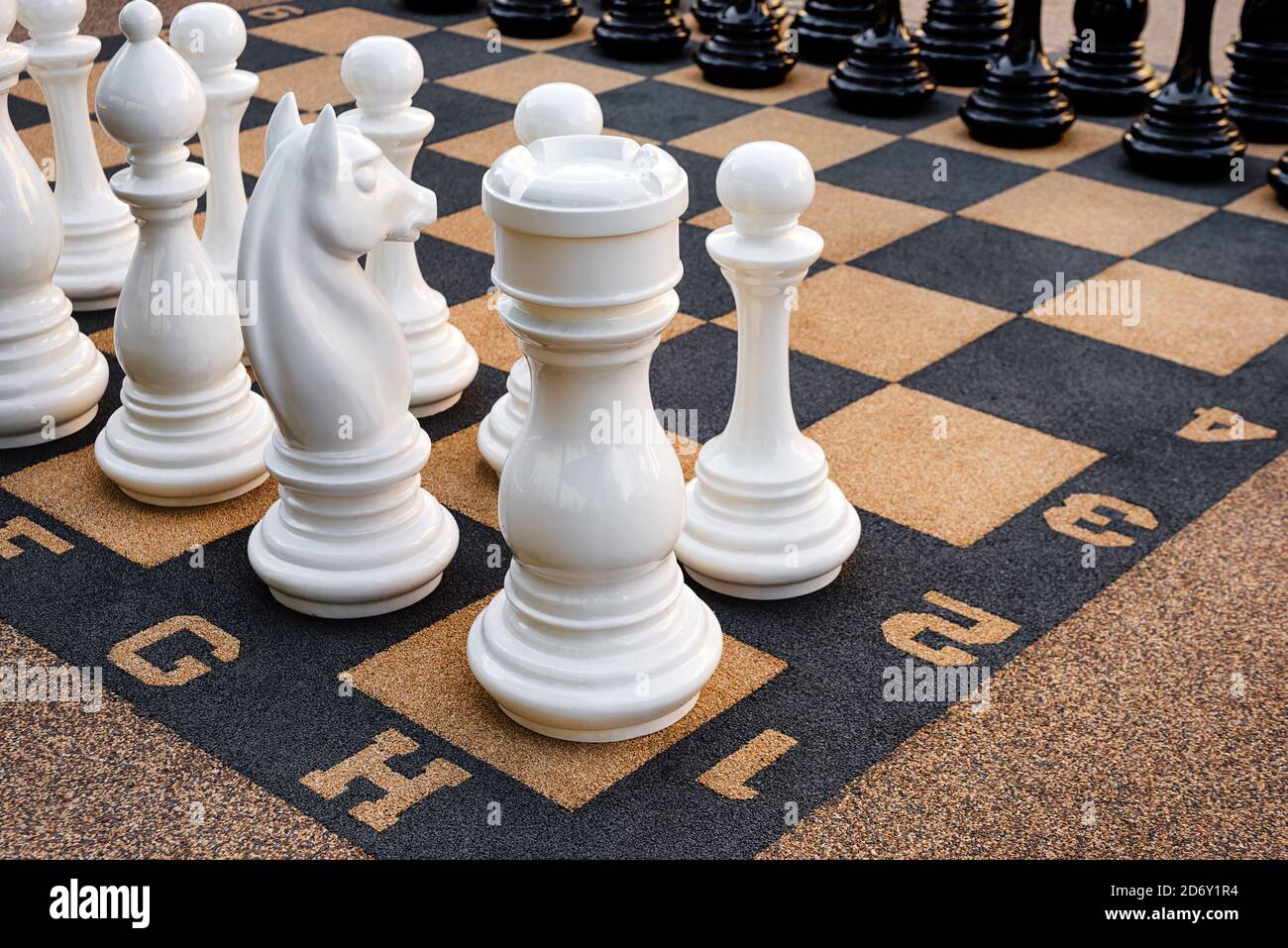 Outdoor chess board with big plastic pieces. Giant size chess in public ...