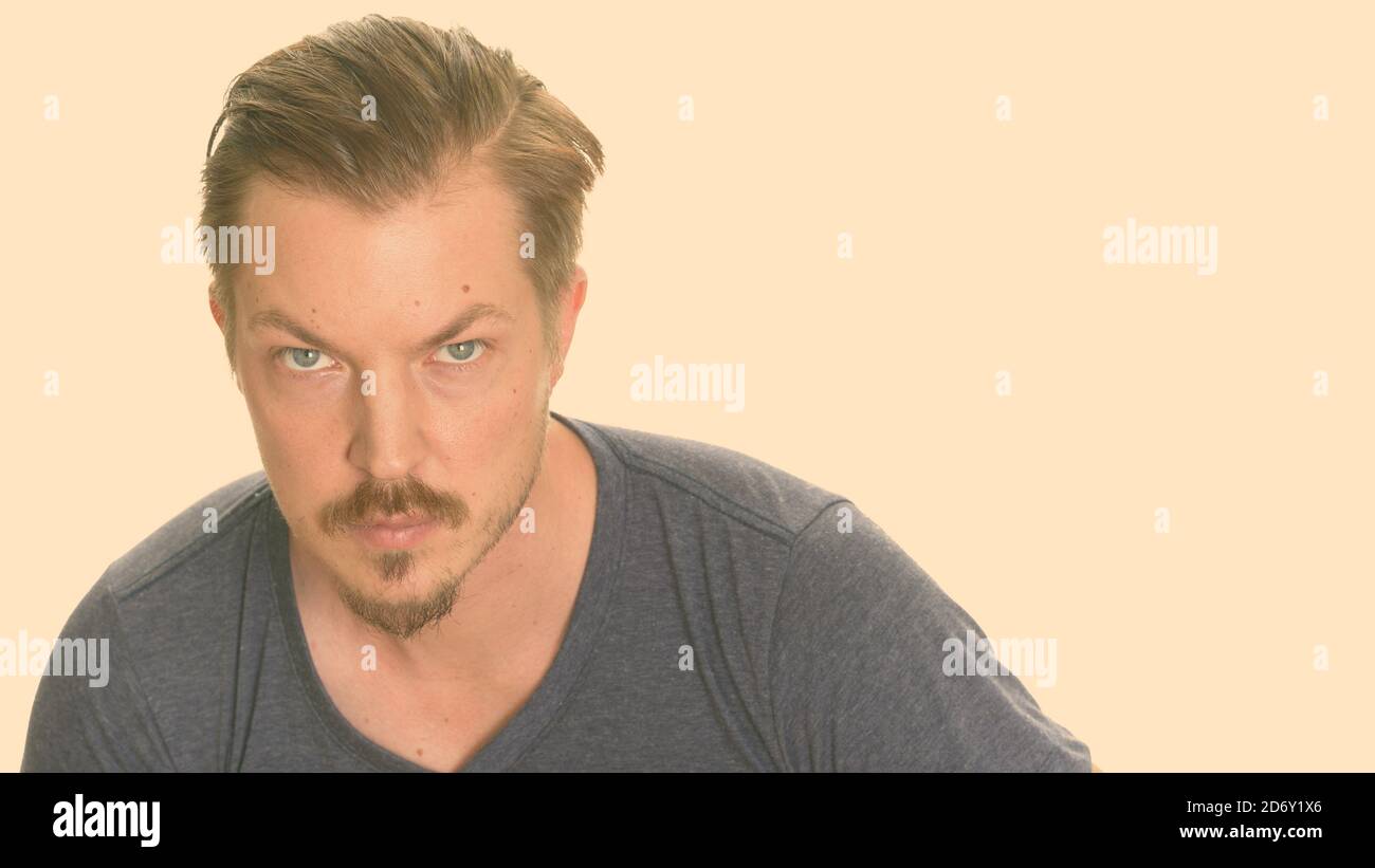 Face of young handsome bearded man with mustache Stock Photo - Alamy