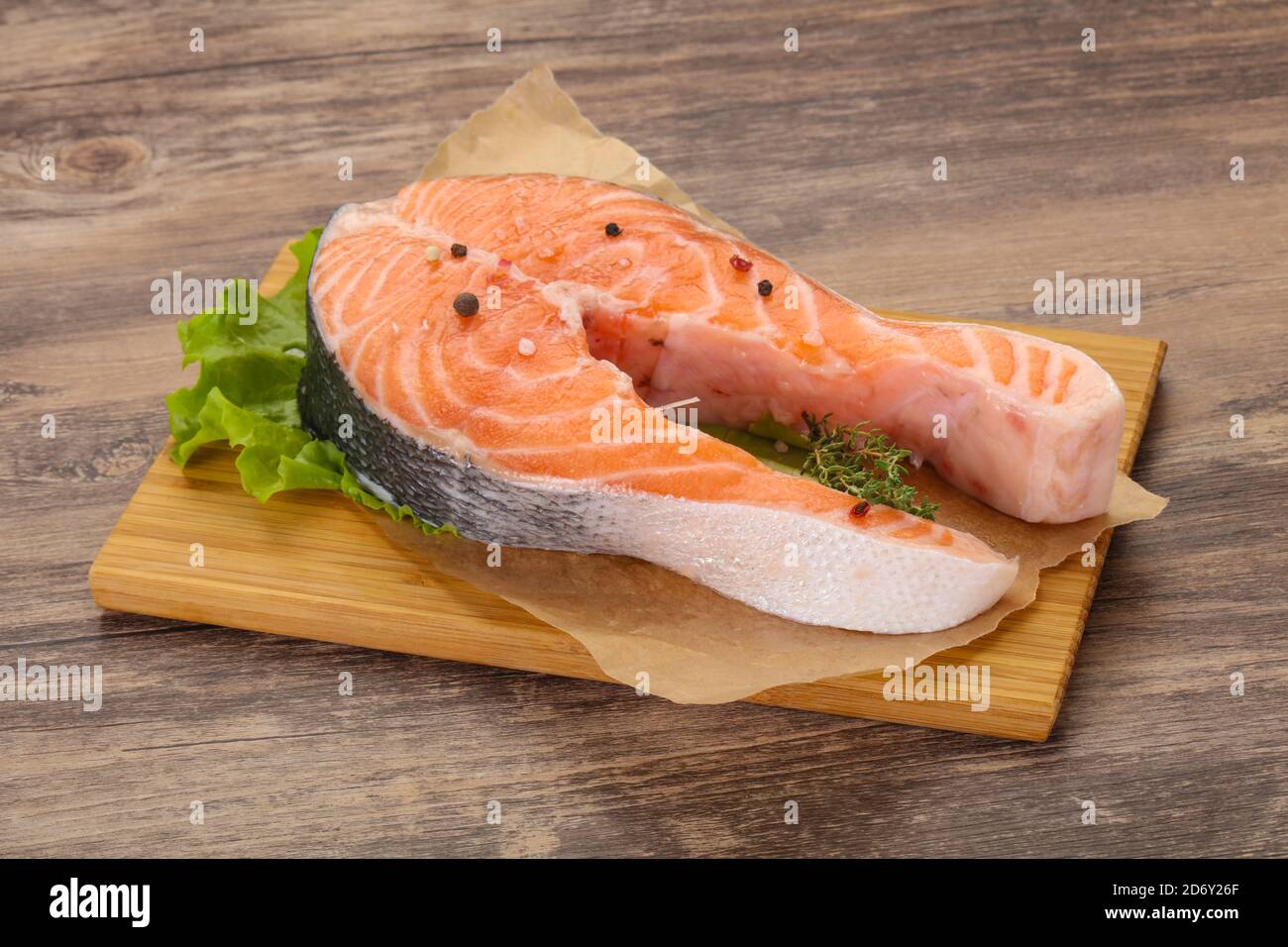 Raw salmon steak with salt and pepper - ready for grill Stock Photo - Alamy