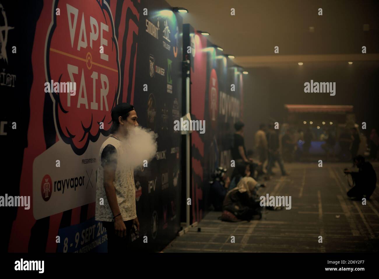 Visitors having photo session and getting a rest in front of a line of ...