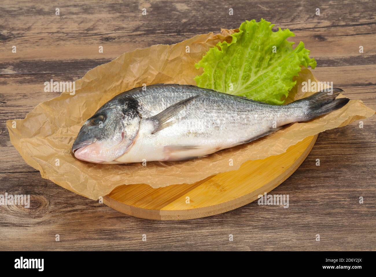 Raw Dorada fish ready for cooking Stock Photo - Alamy